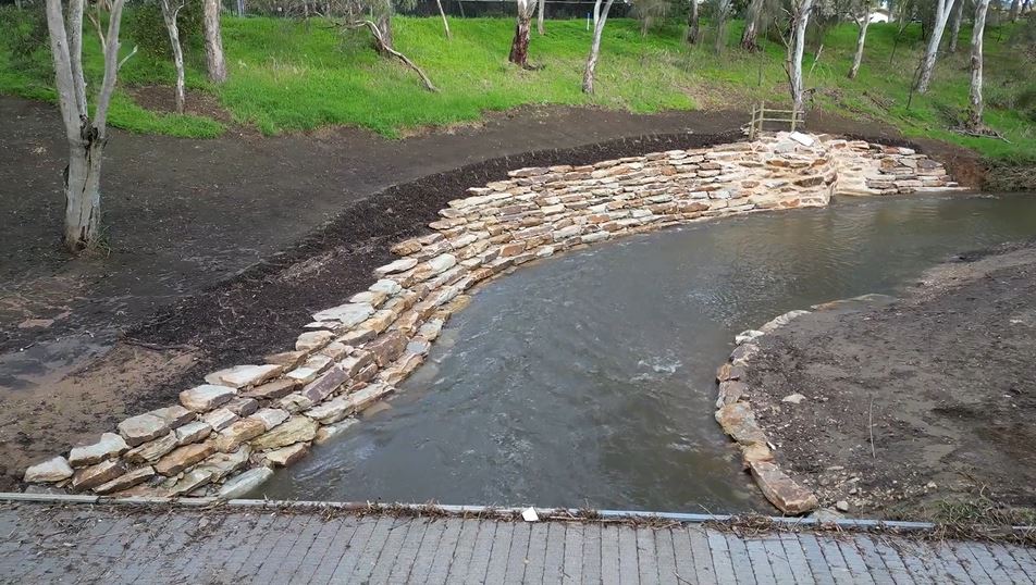 Urbans constructs erosion protection rock wall - Urbans